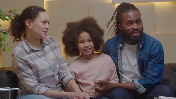 Portrait of happy attractive multicultural family and adorable ...