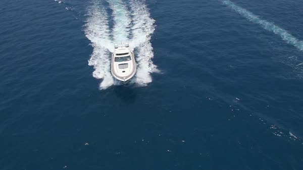 Powerboat speeding across the sea - Stock Video Footage - Dissolve