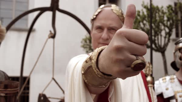 Emperor gives a decided thumbs up and soldiers around him start ...