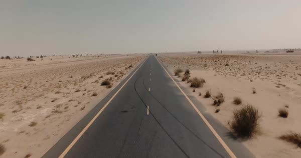 Drone shot of desert in Dubai with road. - Stock Video Footage - Dissolve