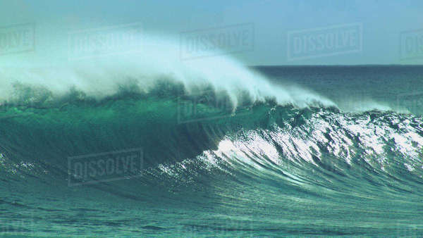 CLOSE UP: Spectacular hollow ocean wave splashes wildly towards the ...