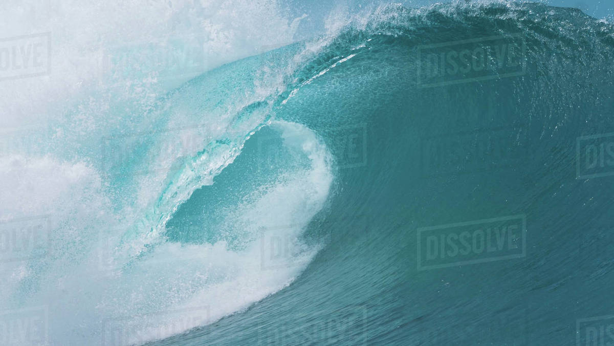 CLOSE UP: Dark blue tube wave rages towards the spectacular tropical ...