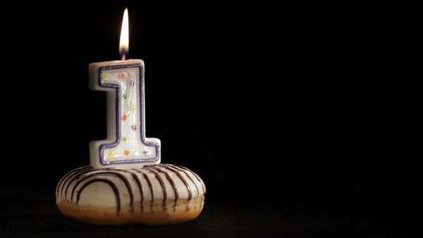 First birthday candle lit in dessert on black background - Stock Video ...