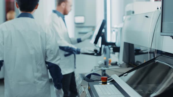 On High Tech Factory Team of Factory Engineers and Workers Use ...