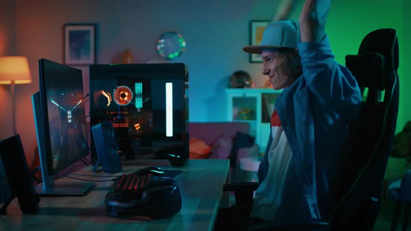 Excited Gamer Playing and Winning in First-Person Shooter Online Video ...