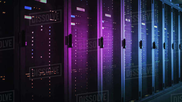 Shot of Dark Data Center With Multiple Rows of Fully Operational Server ...