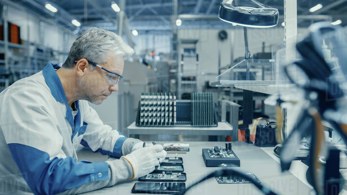 Senior Man in Blue - White Work Coat is Using Plier to Assemble Printed ...
