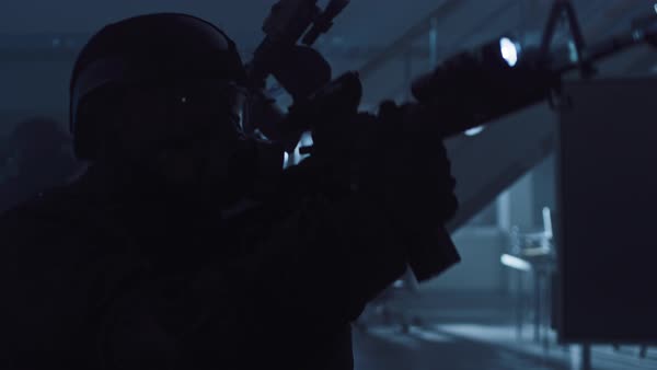 Close up portraits of masked squad of armed swat police officers storm ...