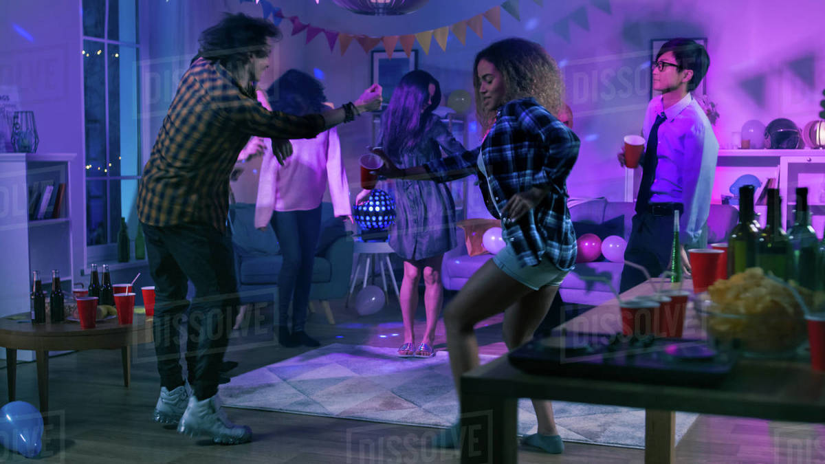 A group of friends dance together at a college party. - Royalty-free ...