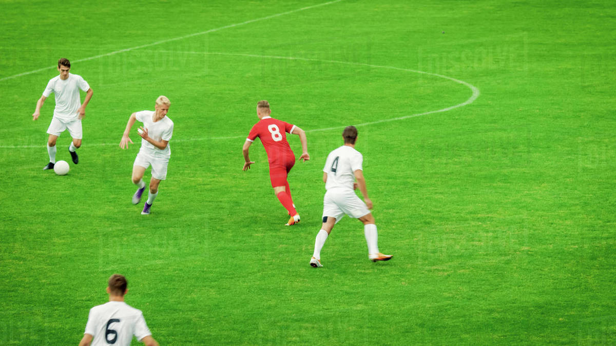 Professional Soccer Players Playing Pass Trying to Score a Goal ...