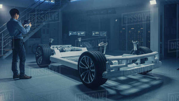 Automobile Engineer Working on Electric Car Chassis Platform, Using ...