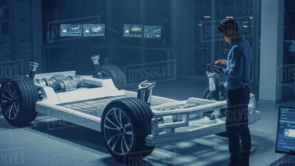 Automobile Engineer Working on Electric Car Chassis Platform, Using ...