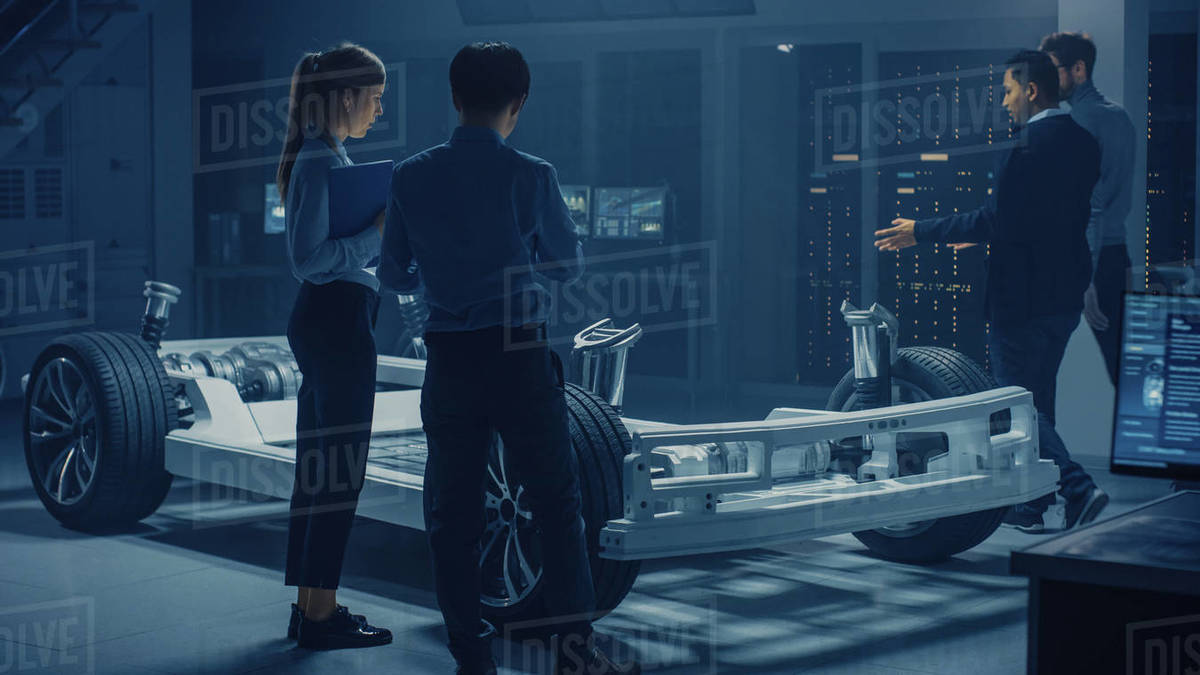 Team of Automotive Engineers Working on Electric Car Chassis Platform ...