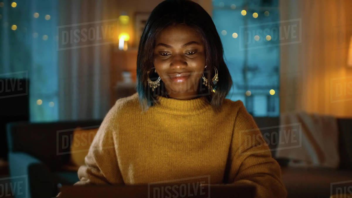 Portrait of Beautiful Black Girl Working on a Laptop while Sitting at ...