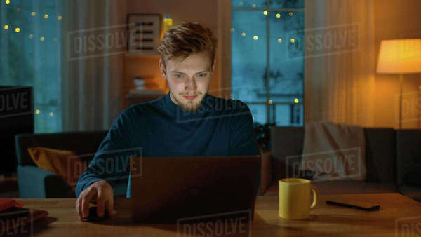 Evening at Home: Portrait of Handsome Man Sitting at His Desk Working ...
