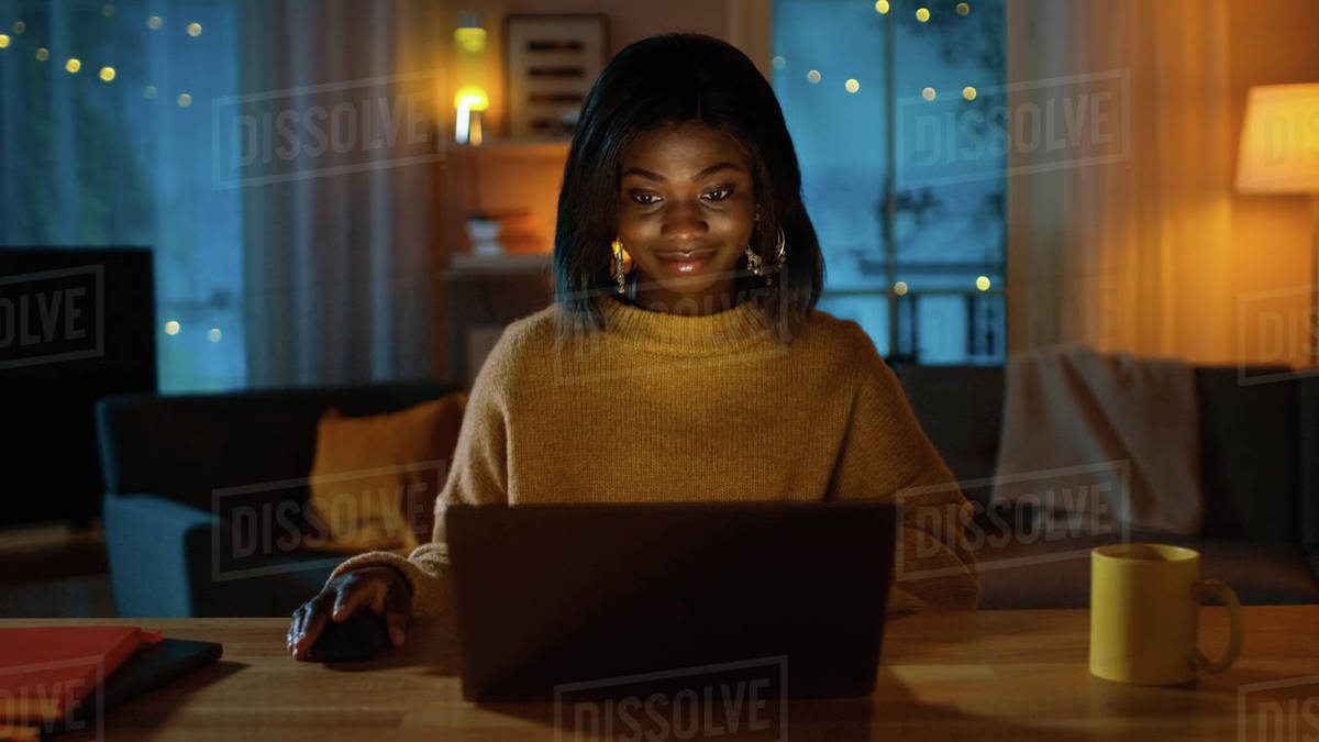 Portrait of Beautiful Smiling Black Girl Using Laptop while Sitting at ...