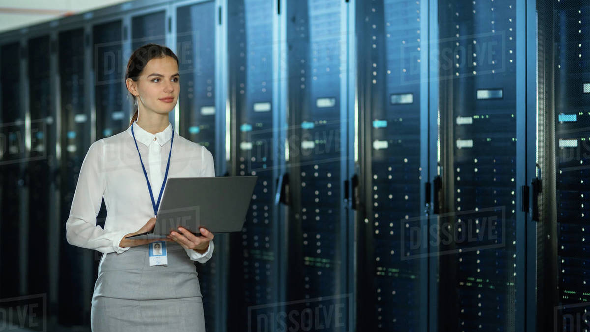 Beautiful Data Center Female IT Technician Walking Through Server Rack ...