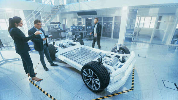 Automotive Design Engineer Shows the Electric Car Chassis Prototype to ...