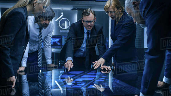 Diverse Team of Government Intelligence Agents Standing Around Digital ...