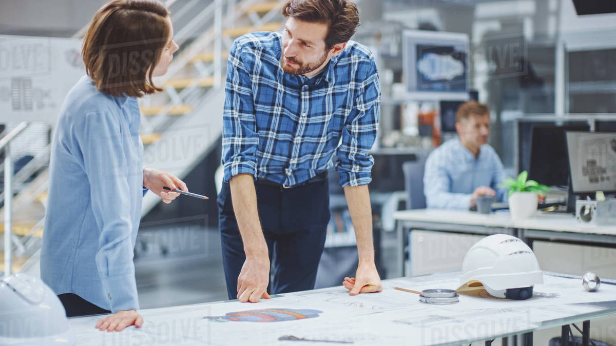 In the Industrial Engineering Facility: Young Female Designer Works ...