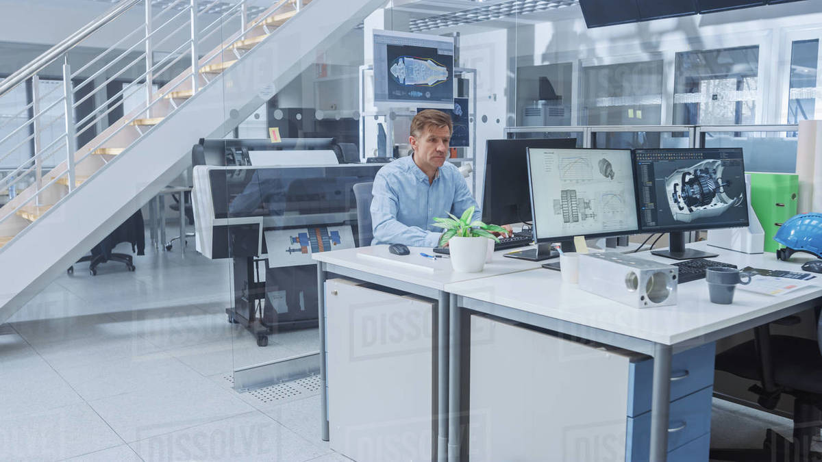 Senior Male Engineer Working on Design for Industrial Engine Prototype ...