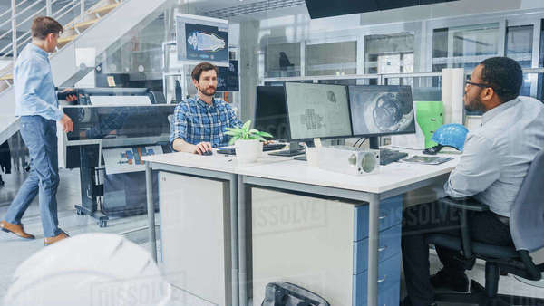 In the Busy Engineering Facility: Diverse Group of Engineers ...