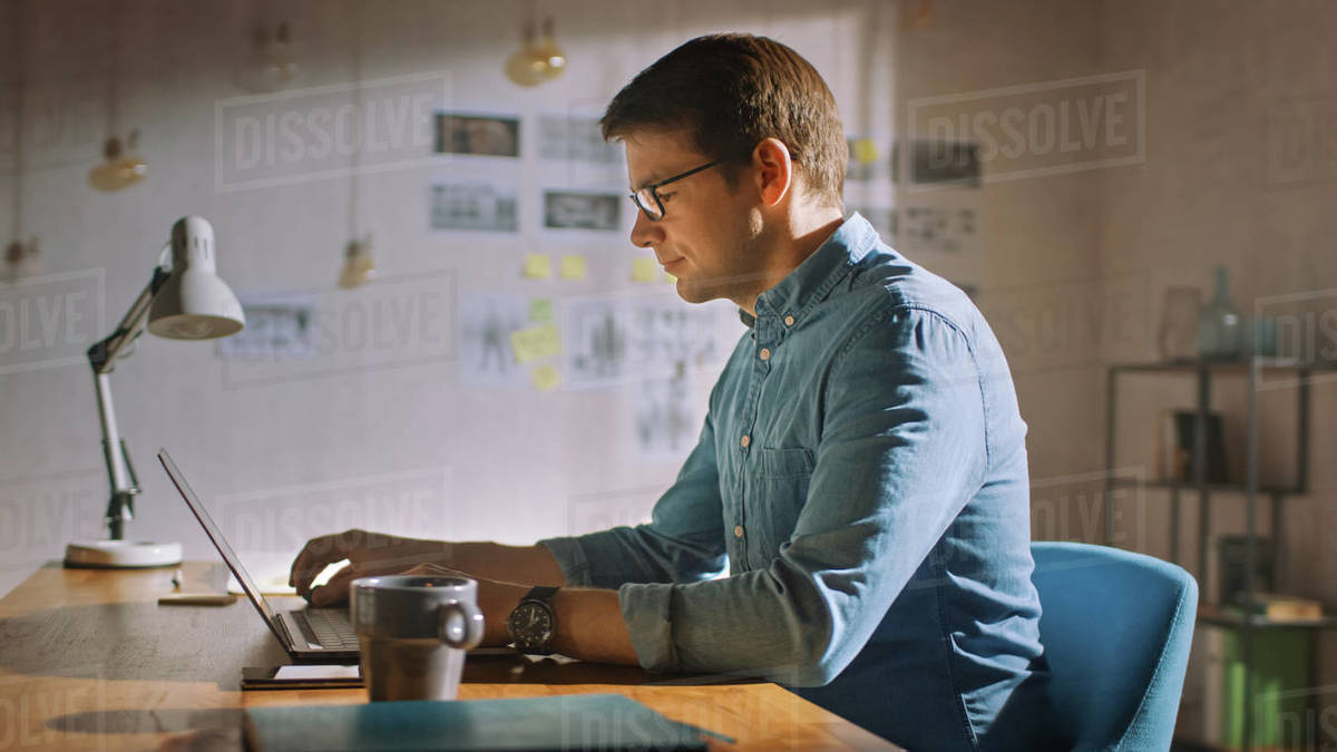Professional Creative Man Sitting at His Desk in Home Office Studio ...
