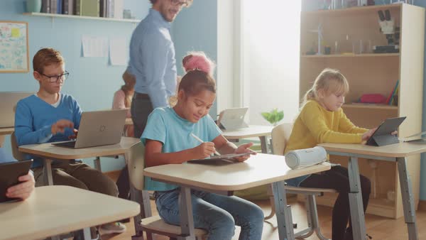 Elementary School Computer Science Class: Smart Boy Uses Laptop ...
