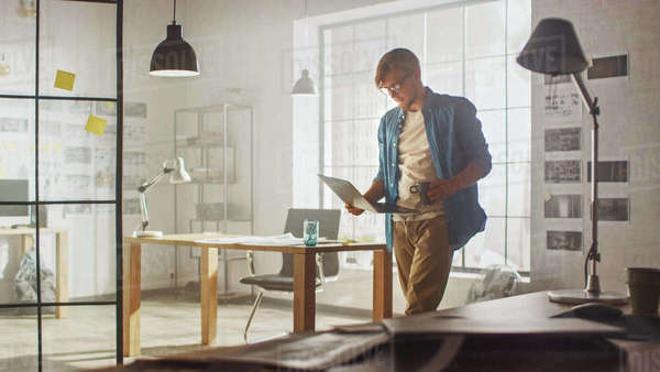 Young Creative Developer is Working in His Studio on a Laptop. Concept ...