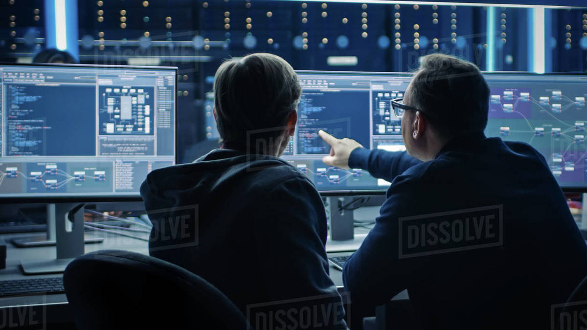 Two Professional IT Programers Discussing Blockchain Data Network ...