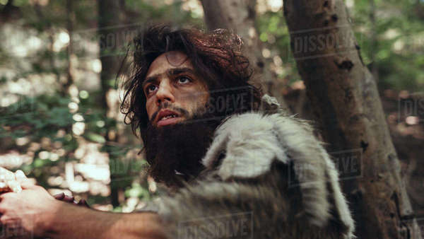 Close-up Portrait of Primeval Caveman Wearing Animal Skin and Fur ...
