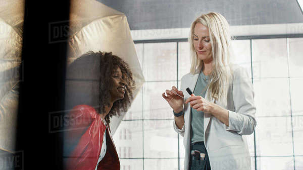 Backstage of the Photo Shoot: Make-up Artist Applies Makeup on ...