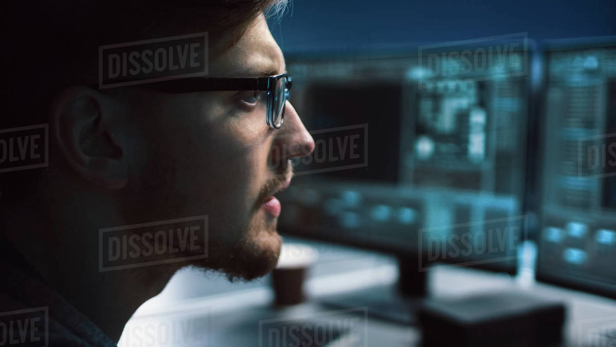 Portrait of IT Specialist Wearing Glasses Works on Personal Computer ...