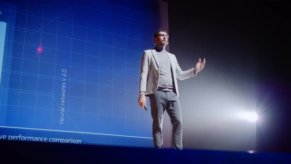 On-Stage Speaker Greets Audience, Presentation of Technological Device ...