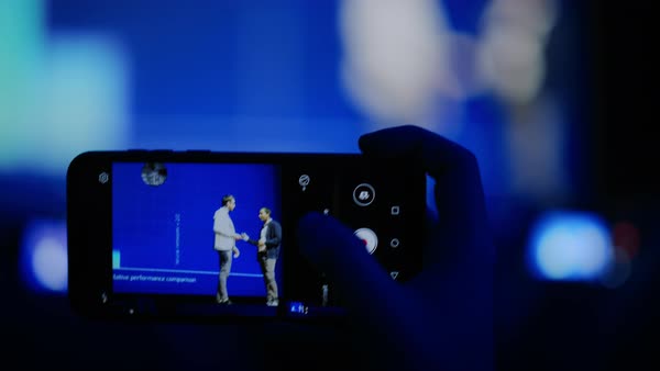 Audience Use Smartphones to Record Two Speakers Talking on Business ...