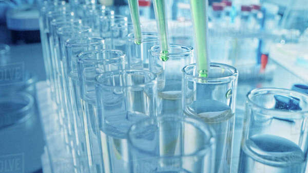 Pharmaceutics Laboratory: Multiple Pipettes Dropping Blue Liquid into ...