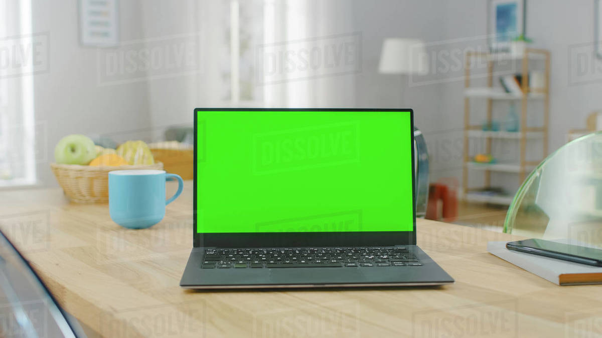 Shot of a Modern Laptop with a Horizontal Green Screen Mock Up on a ...