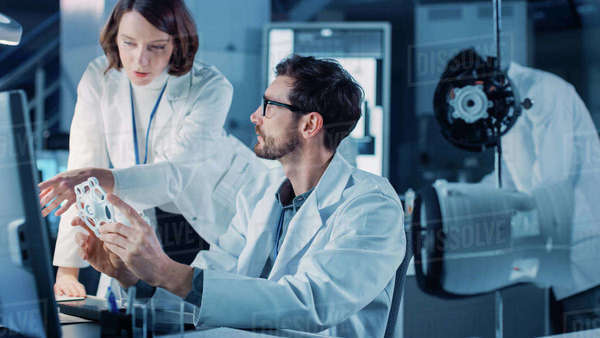 Machine Engine Development Engineer Working on Computer at His Desk ...