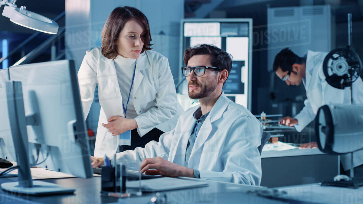 Machine Engine Development Engineer Working on Computer at His Desk ...