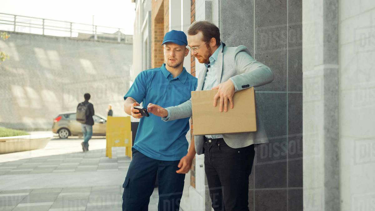 Delivery Man Gives Postal Package to a Business Customer, Who Signs ...