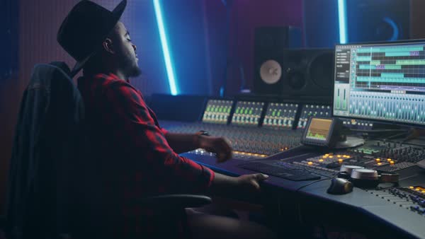 Energetic Male Audio Engineer / Producer Working in Music Recording ...