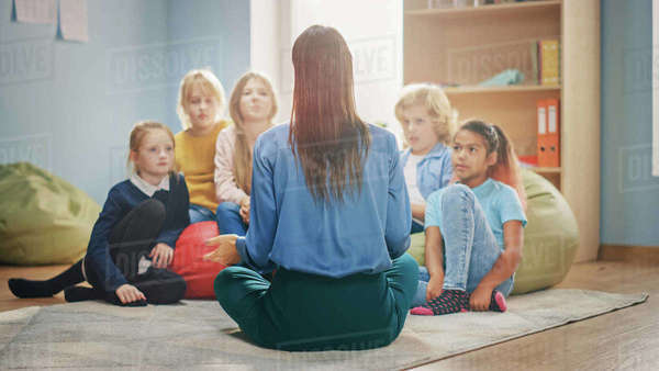 Elementary School Creativity Class: Diverse Children Sitting on Carpet ...