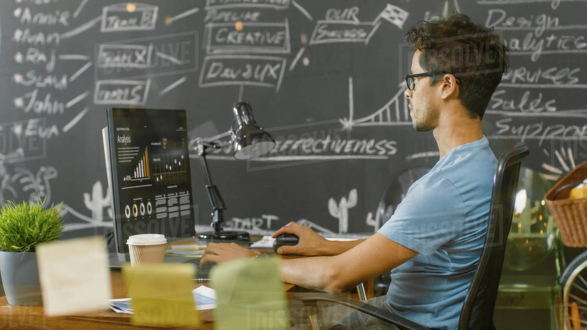 Creative Developer Work on a Personal Computer while Sitting at His ...