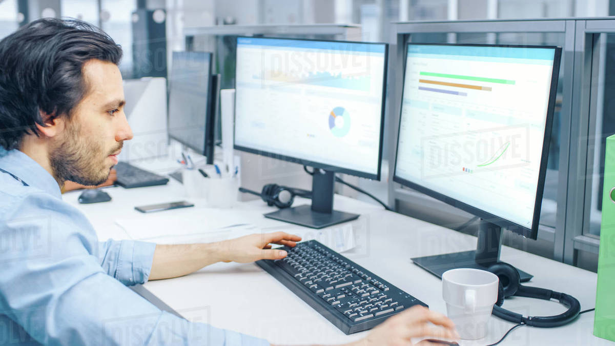 Over the Shoulder Shot of Motivated Office Worker Working on Desktop ...