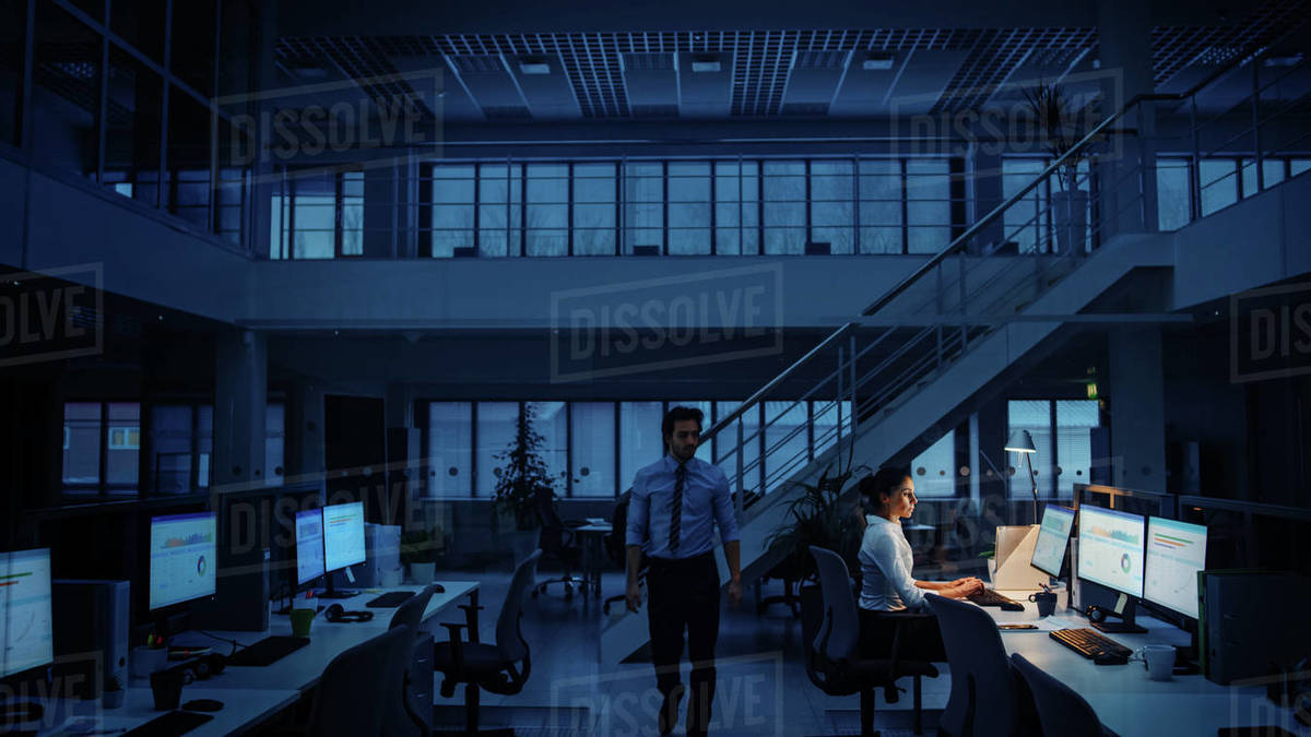Working Late at Night in the Office: Businesswoman Using Desktop ...