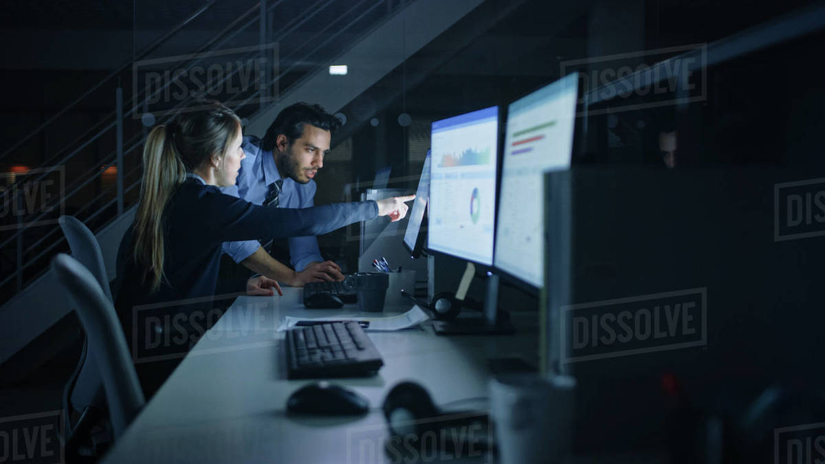 Confident Businessman Uses Desktop Computer, Her Male Manager Explains ...