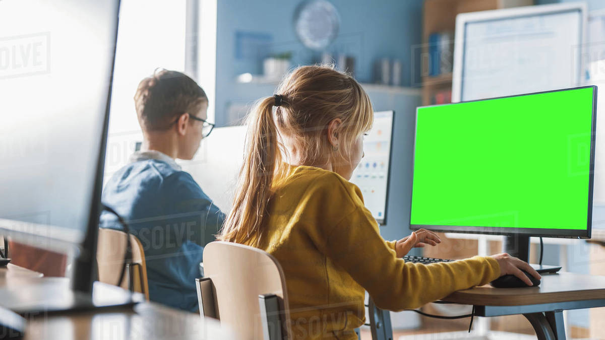 Elementary School Computer Science Classroom: Cute Little Girl Uses ...