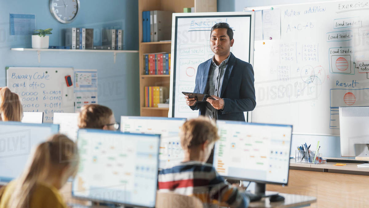 Elementary School Computer Science Class: Teacher Uses Digital Tablet ...