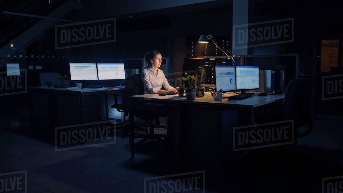 Working Late at Night in the Office: Businesswoman Uses Desktop ...