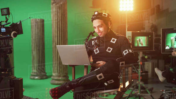 Handsome Smiling Actor Wearing Motion Capture Suit and Head Rig having ...